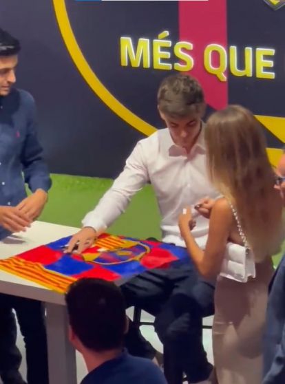 Watch: Gavi appears to keep phone number while signing autographs ...