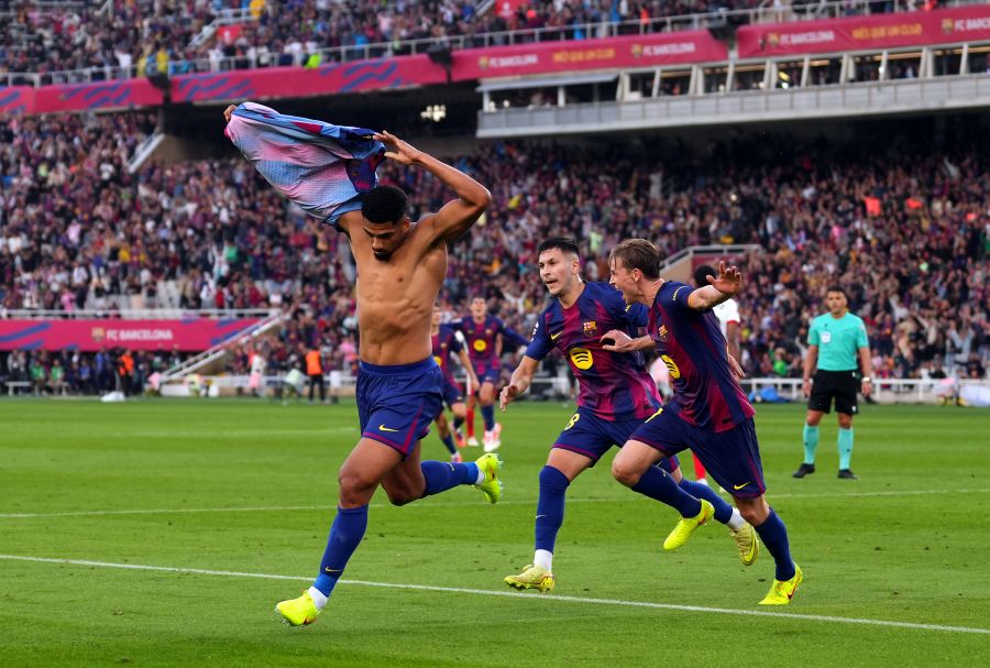 Heroic Ronald Araujo seals late Barcelona victory in Catalan derby
